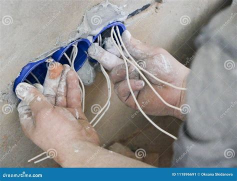 Wall Socket Installation Work On Installing Electrical Outlets Electrician Prepares The Wiring