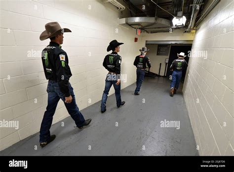 Bull Riders Make Their Way To A Pre Competition Ceremony Before Competing In Round One Of The