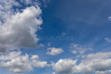 The Wind Blows Fluffy White Clouds In The Blue Sky Stock Image Image