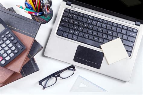 Premium Photo Studying Table With Laptop And Stationery