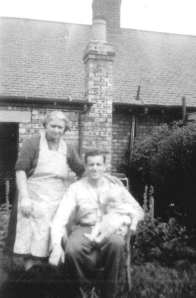 Husband And Wife With Eldest Son In Back Garden At Lingerwood Road