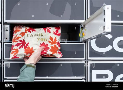 A Customer Delivers Or Collects A Parcel To A Inpost Locker After