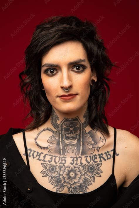 Portrait Of Transgender Woman With Chest Tattoos And Piercings Stock Photo Adobe Stock