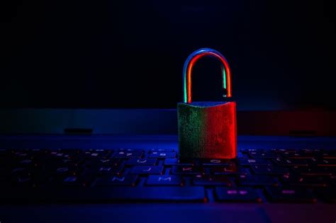 Premium Photo Padlock On Laptop Keyboard In Dark Room