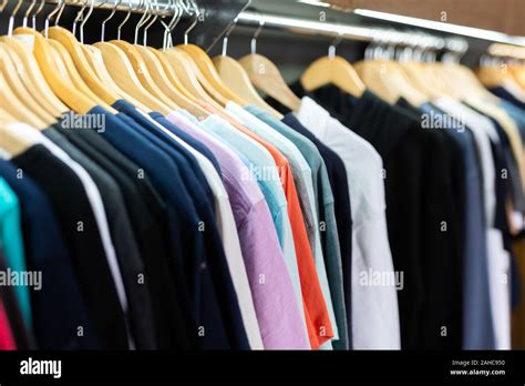 Assortment of summer and autumn clothing in modern garment store ...