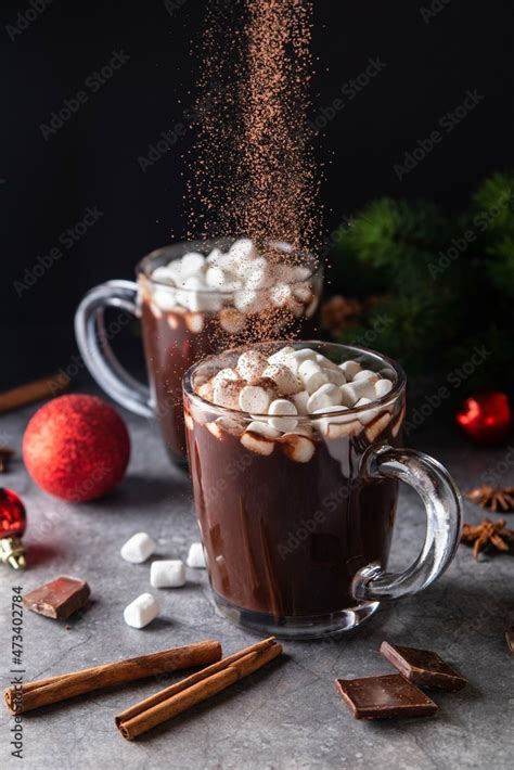 Dripping Powder On Glass Mug With Hot Chocolate Cocoa Drink With