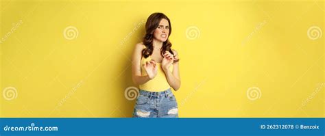 Disgusted Young Woman Cringe From Dislike And Aversion Step Back