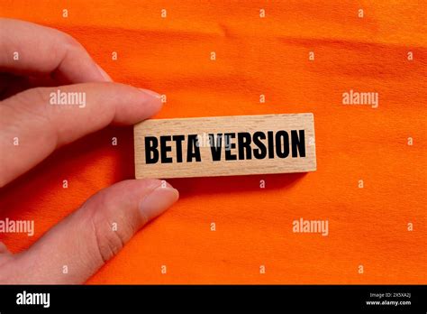 Beta Version Words Written On Wooden Block With Orange Background