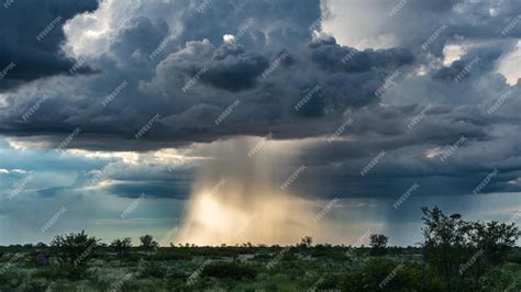 Premium Photo Dark Storm Clouds With Rays Of Of Sunlight Highlighting