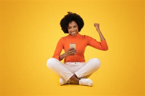 Premium Photo A Joyful Young Woman With Natural Curly Hair Celebrates