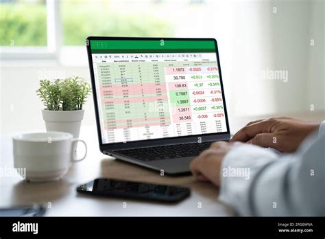 Businessman Working With Data And Graphs In Spreadsheet Documents For