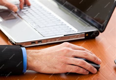 Premium Photo Male Hands Typing On A Laptop Keyboard