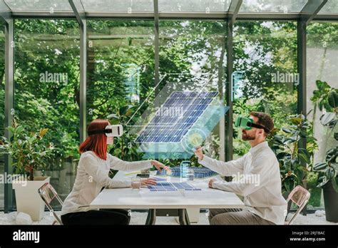 Engineers Wearing Virtual Reality Simulators Designing Solar Panels