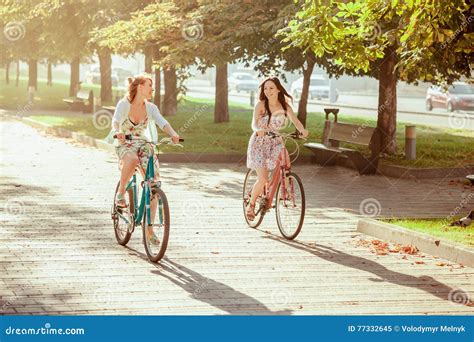 The Two Young Girls With Bicycles In Park Stock Image Image Of