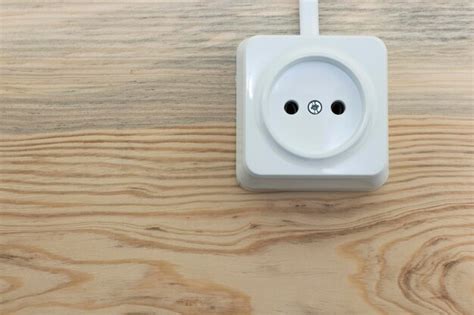 Premium Photo White Overhead Socket On Wooden Background Close Up