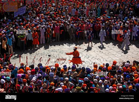 Nihang Or Sikh Warriors Performing Stunts With Swords During Hola
