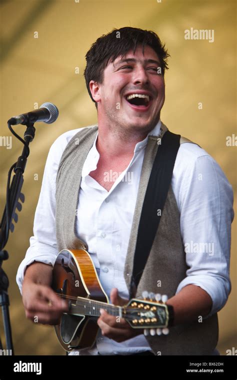 Marcus Mumford Of The Band Mumford And Sons Plays Guitar And Sings Vocals
