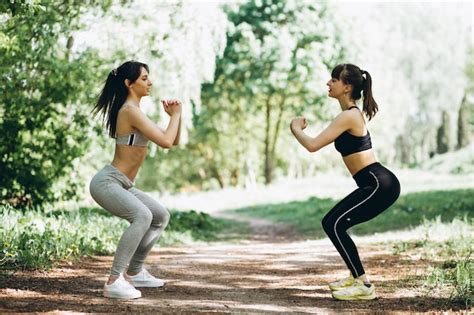 Free Photo Two Fit Girls Stretching In Park
