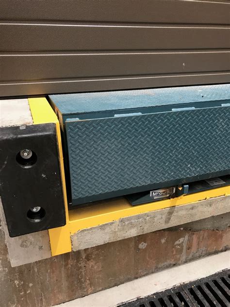 Extended Loading Dock Levelers And Tapered Dock Seals For Declining Driveways