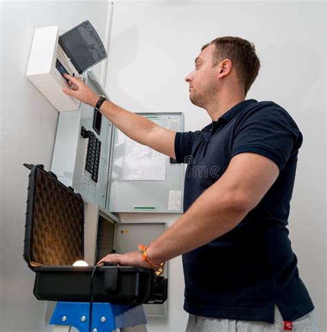 A Technician Works With A Demo Kit Of The Smart Home System Stock Image