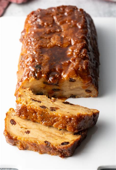 Sliced Meatloaf Sitting On Top Of A White Plate
