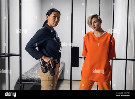 Blonde Inmate In An Asian Womens General Security Prison Is Led Out Of