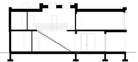 House By Sergey Makno Combines A Staircase With A Bookcase
