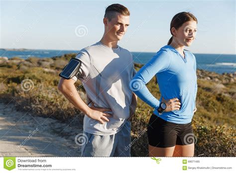 Young Couple On Beach Training Together Stock Image Image Of Exercise