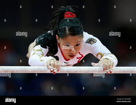 German Gymnast Kim Bui Performs On The Uneven Bars During The Artistic