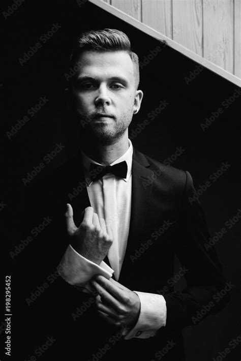 Sexy Man In Tuxedo And Bow Tie Posing Stock Photo Adobe Stock