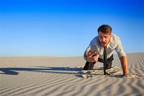 Free Photo Poor Signal Businessman Searching For Mobile Phone Signal In Desert
