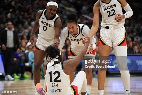Chelsea Gray Of The Las Vegas Aces Is Helped Up By Teammates Alysha