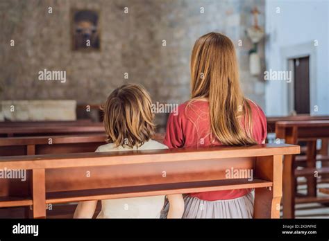 A Christian Mom Tells Her Son Bible Stories About Jesus Sitting In