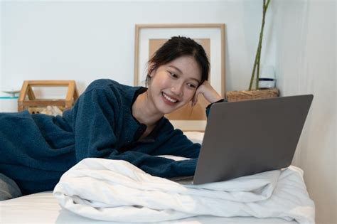 Premium Photo Lovely Asian Girl Enjoying A Movie On Her Laptop Cute