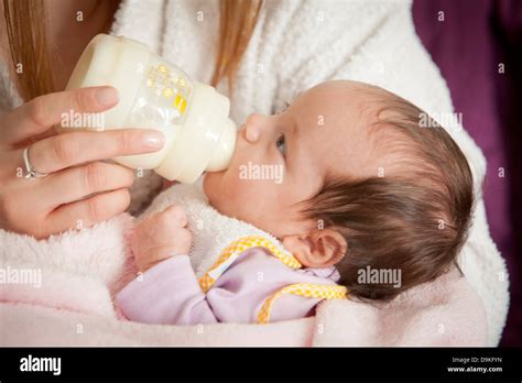 Newborn Baby Girl Nursed With Baby Bottle Stock Photo Alamy