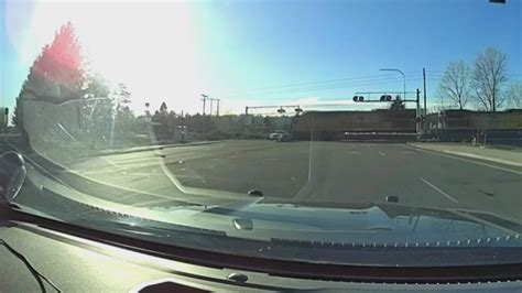 Dashcam Video Shows Fleeing Robbery Suspect Narrowly Misses Train