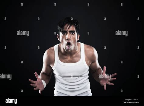 Portrait Of A Man Shouting And Looking Shocked Stock Photo Alamy