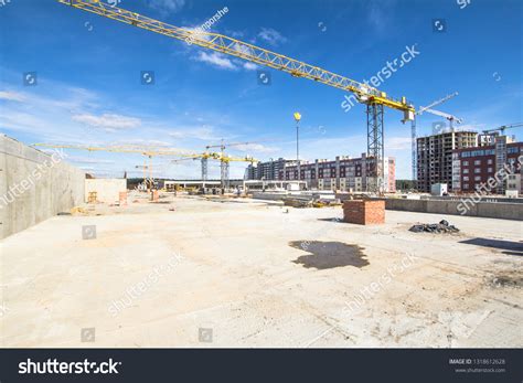 Стоковая фотография 1318612628 Construction Area Yellow Cranes Summer