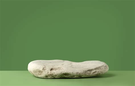 녹색 배경에 돌이 있는 모형 장면 화장품 프리젠 테이션 또는 패키지 광고를위한 자연 받침대 광고 무대 공간을 복사합니다 개념에