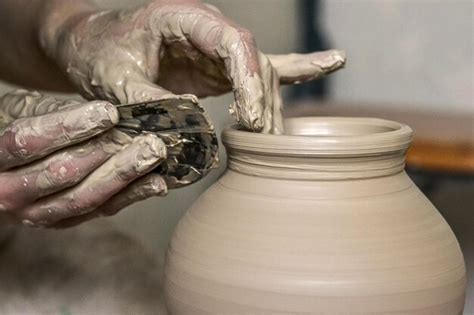 Premium Photo Making Crock Crude Wet Close Up Man Hands And Tool