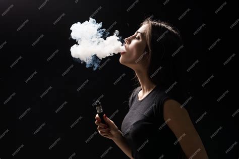 Free Photo Young Beautiful Brunette Woman Smoking Vaping E Cigarette