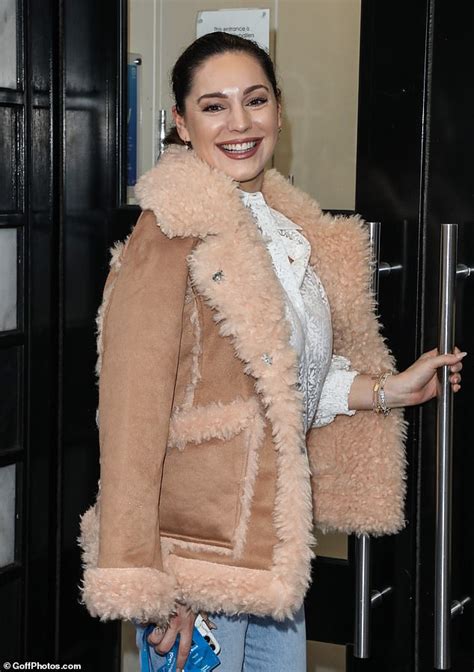 Kelly Brook Flashes Her Bra Through A Sheer Blouse As She Arrives To