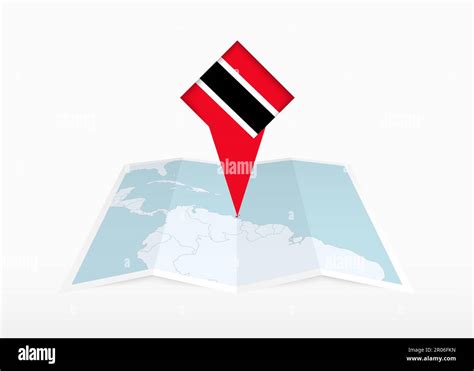 Trinidad And Tobago Is Depicted On A Folded Paper Map And Pinned Location Marker With Flag Of