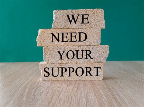 Premium Photo We Need Your Support Symbol Brick Blocks With Words We