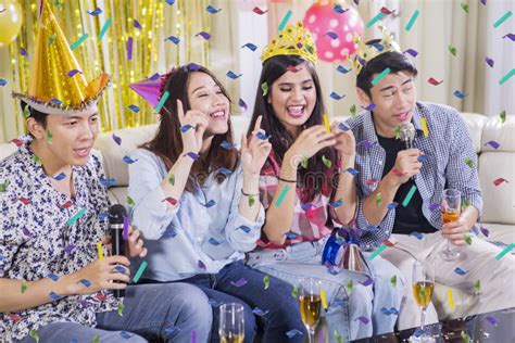 Two Young Couples Having Fun At A Birthday Party Stock Image Image Of