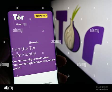 Person Holding Cellphone With Webpage Of Anonymous Communication