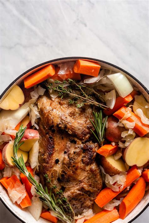 Slow Cooked Pork Roast With Sauerkraut Potatoes And Carrots