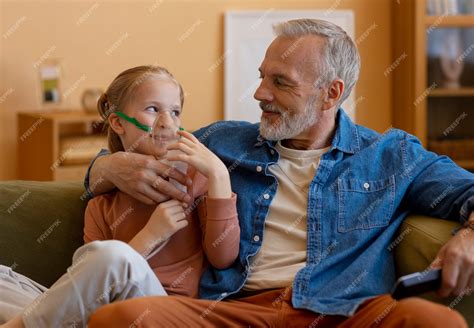 Premium Photo Front View Man And Girl With Nebulizer