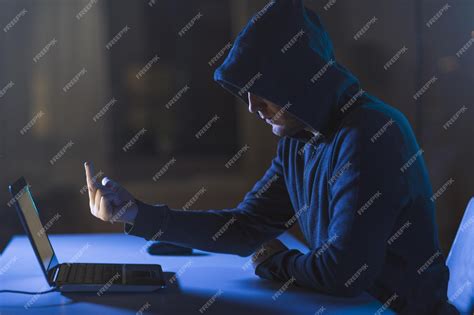 Premium Photo Hacker Showing Middle Finger To Laptop