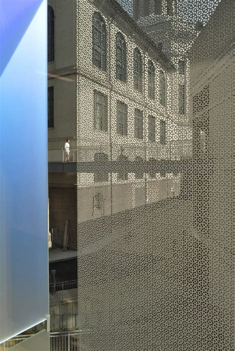 Dichroic Glass Turns A Curtainwall Into A Shimmering Veil